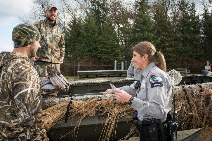 Warden Amanda Kretschmer with hunters. - Wisconsin Waterfowl Association